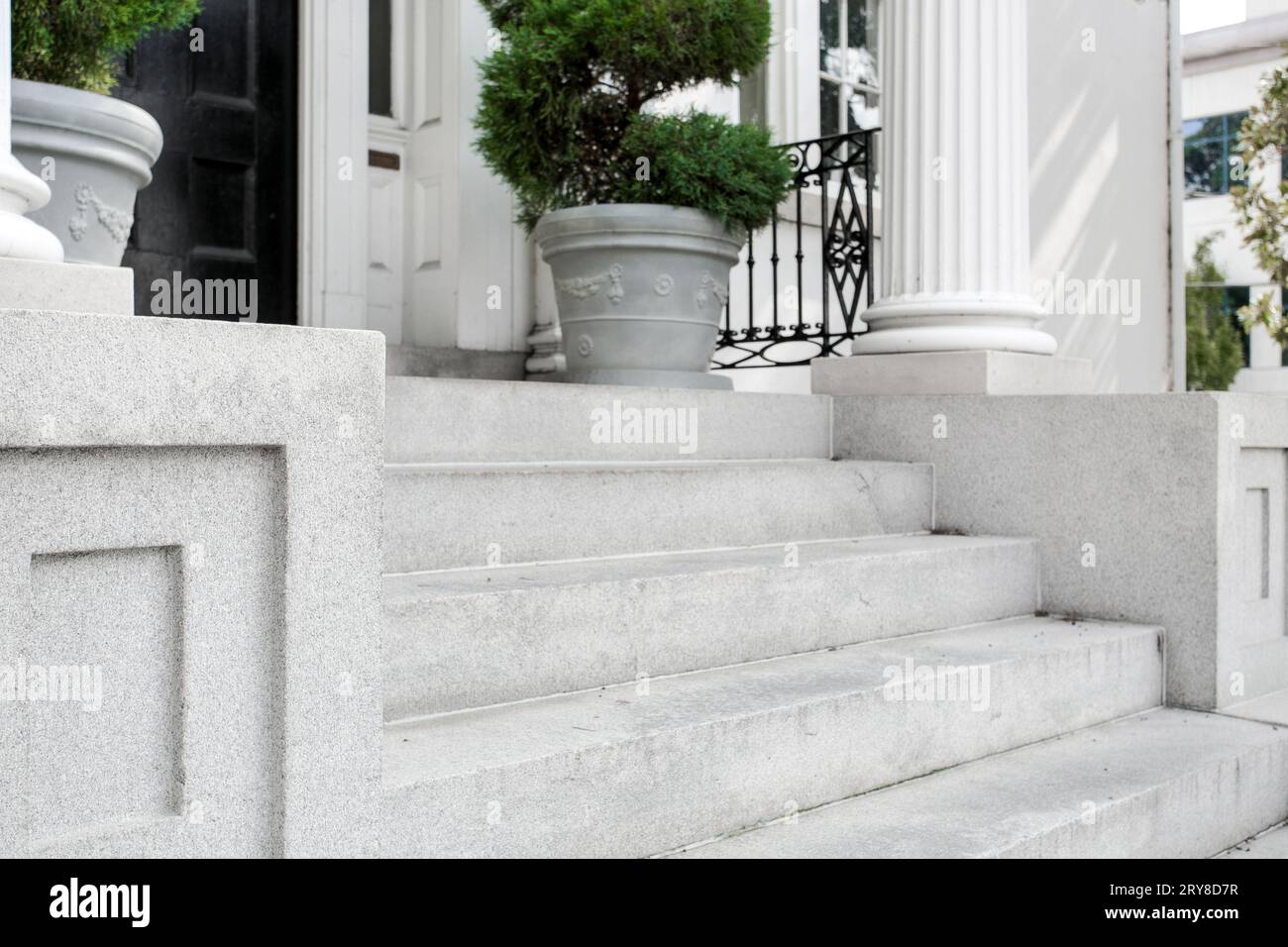 Historical White Front Porch Concrete Steps with Topiary in Planter ...