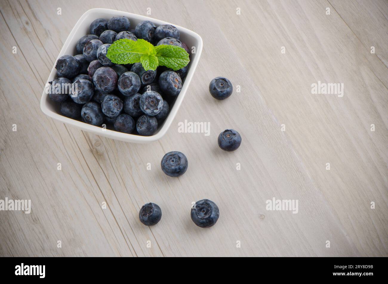 Blueberries in small bowl Stock Photo - Alamy
