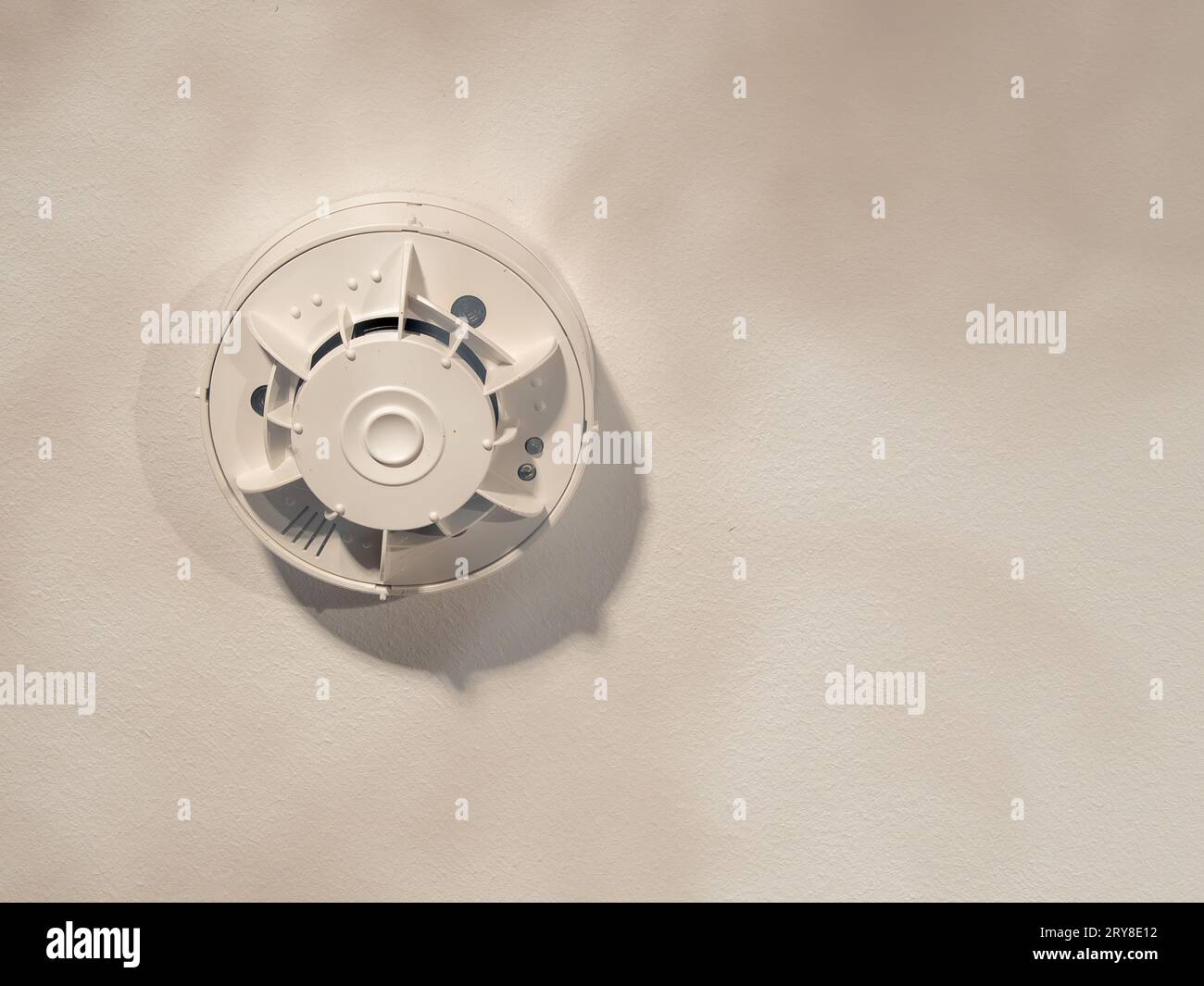 The smoke detector is installed on the ceiling and smoke rises ...