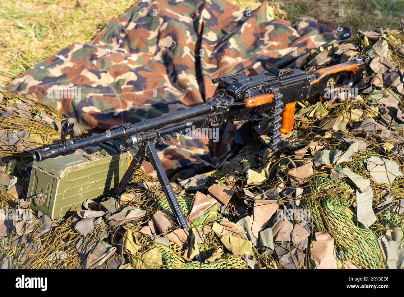 Soviet-made PK machine gun and camouflage netting.. "Kalashnikov's ...