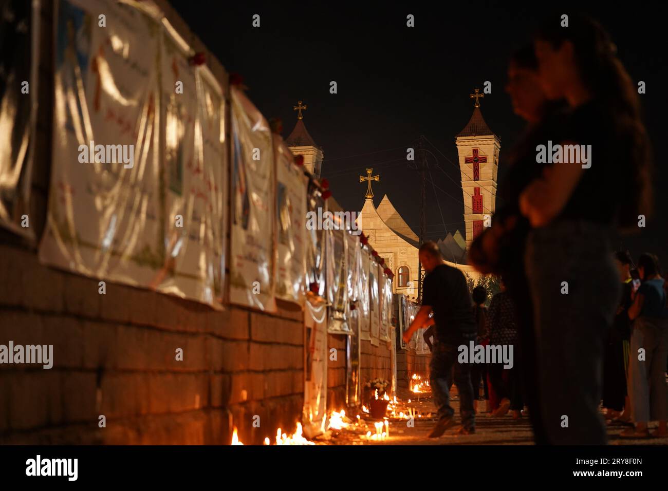 Hamdaniya, Iraq. 29th Sep, 2023. People light candles outside St Mary ...