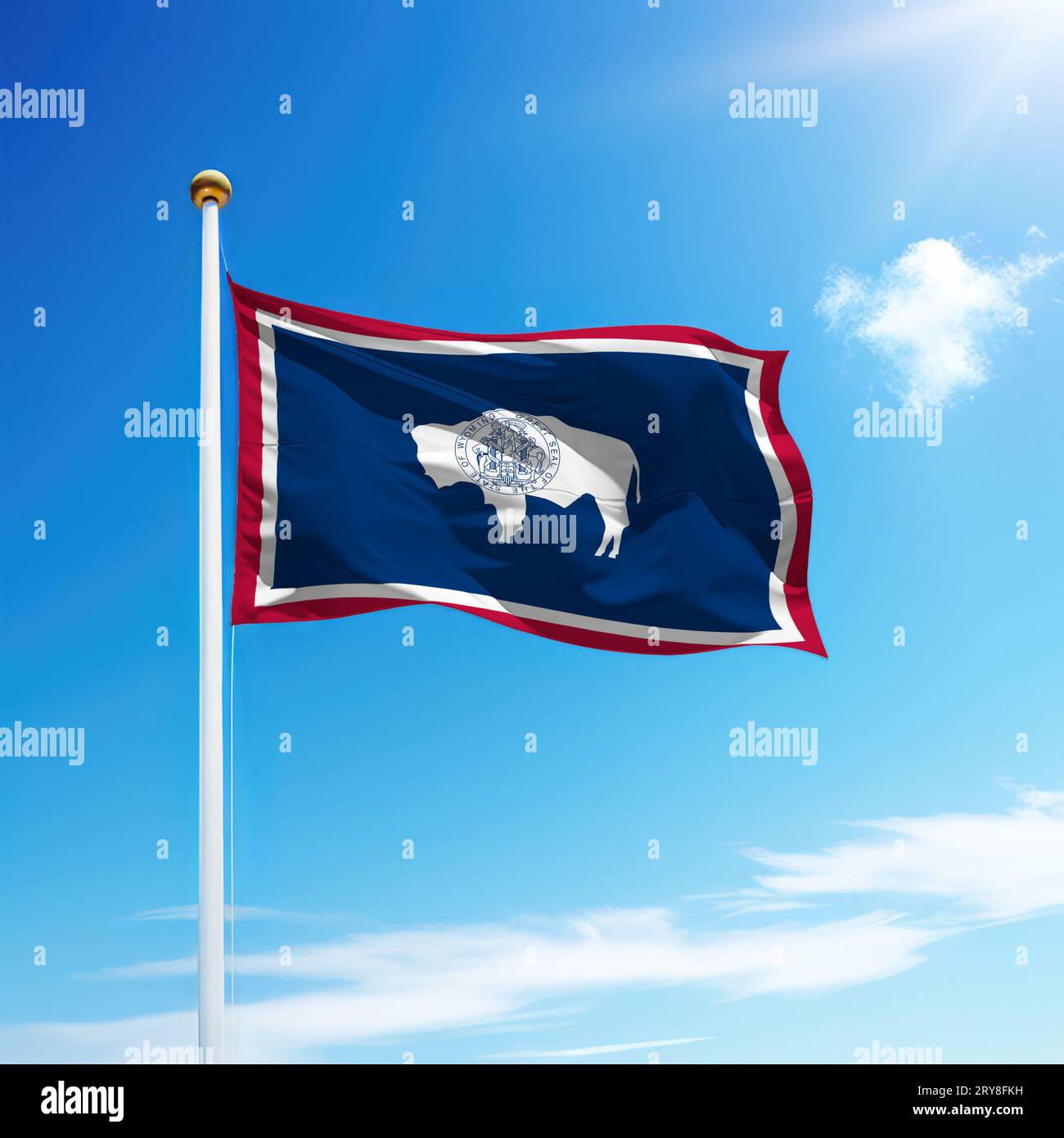 Waving flag of Wyoming is a state of United States on flagpole with sky ...