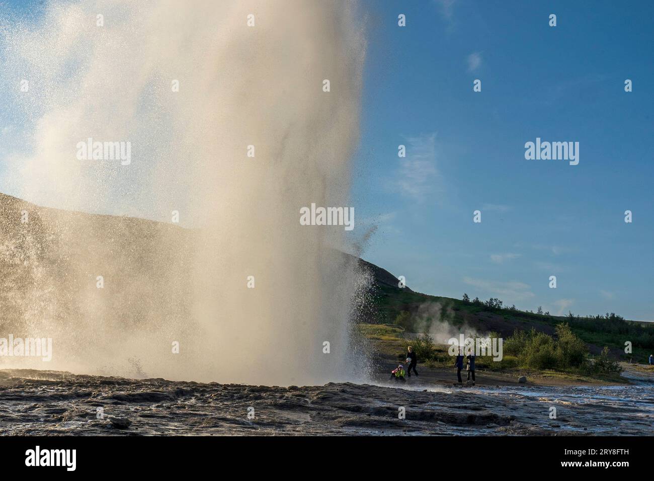 Strokkur, a fountain-type geyser located in a geothermal area beside ...