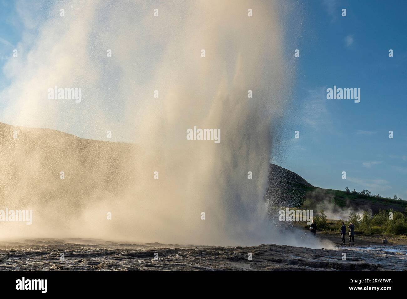 Strokkur, a fountain-type geyser located in a geothermal area beside ...
