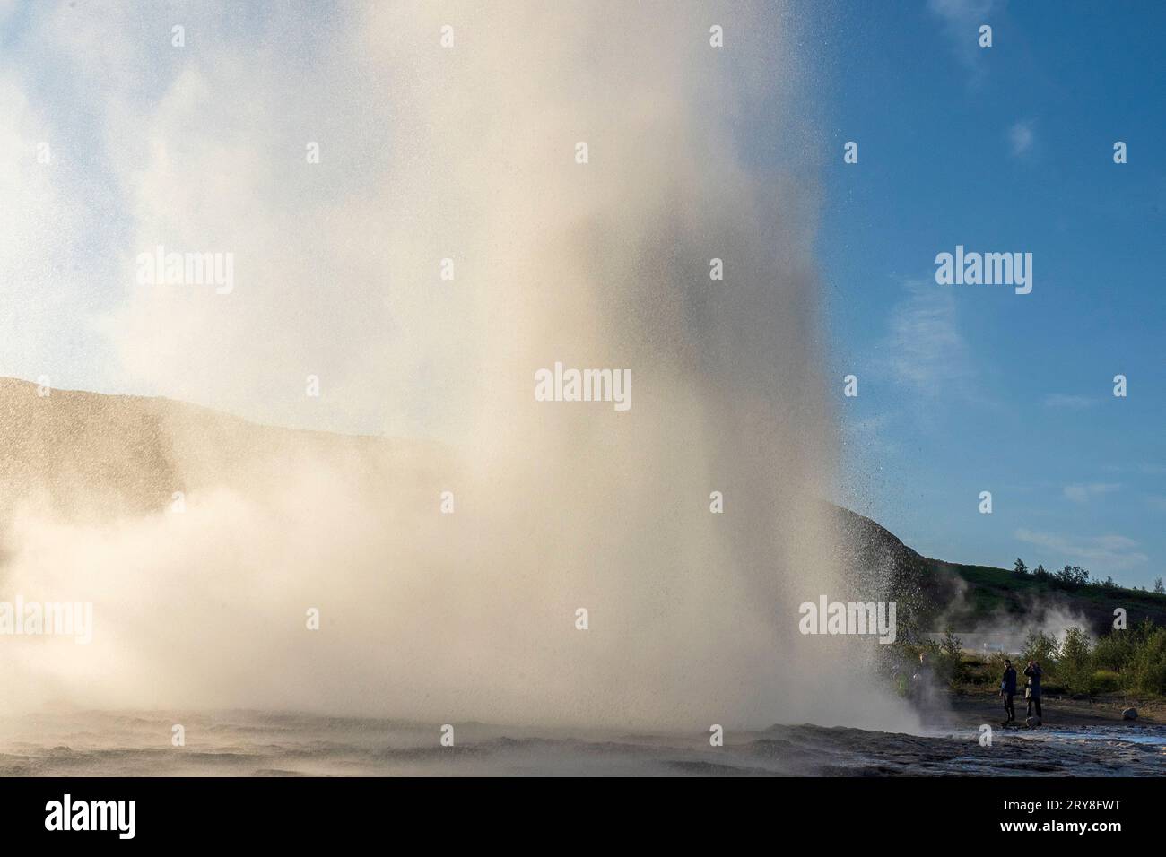 Strokkur, a fountain-type geyser located in a geothermal area beside ...