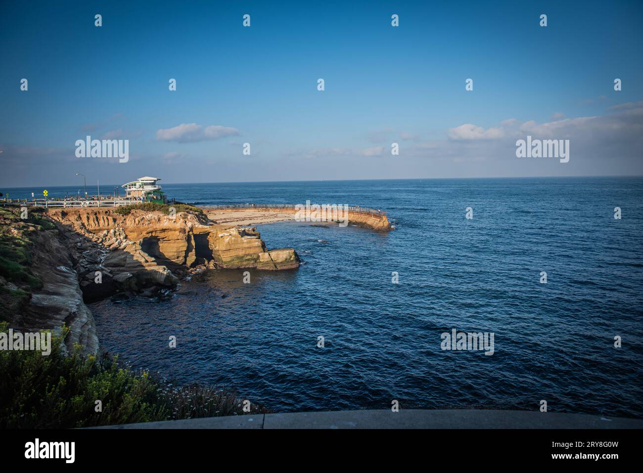 curved ocean pier with waves Stock Photo - Alamy