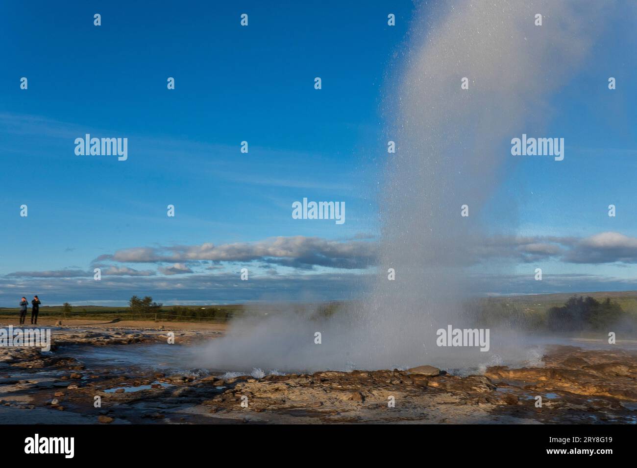Strokkur, a fountain-type geyser located in a geothermal area beside ...