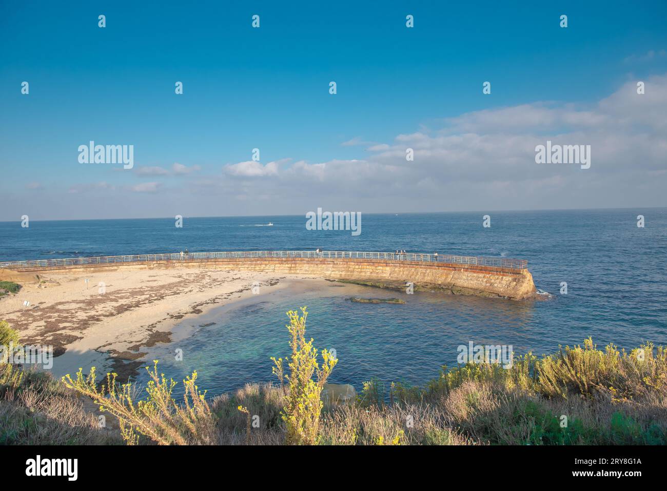 curved ocean pier with waves Stock Photo - Alamy