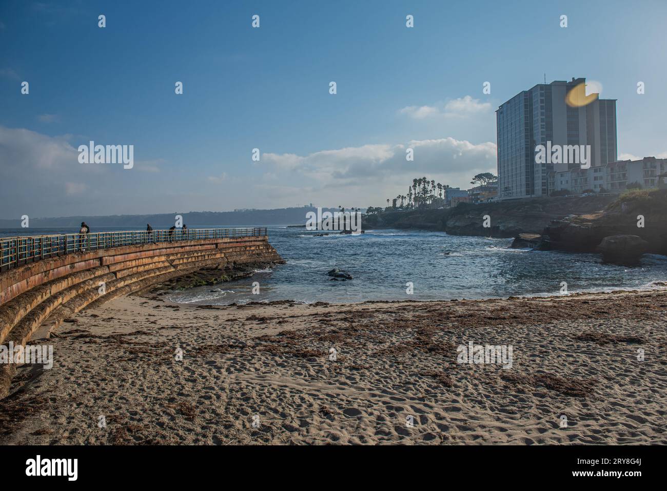 curved ocean pier with waves Stock Photo - Alamy