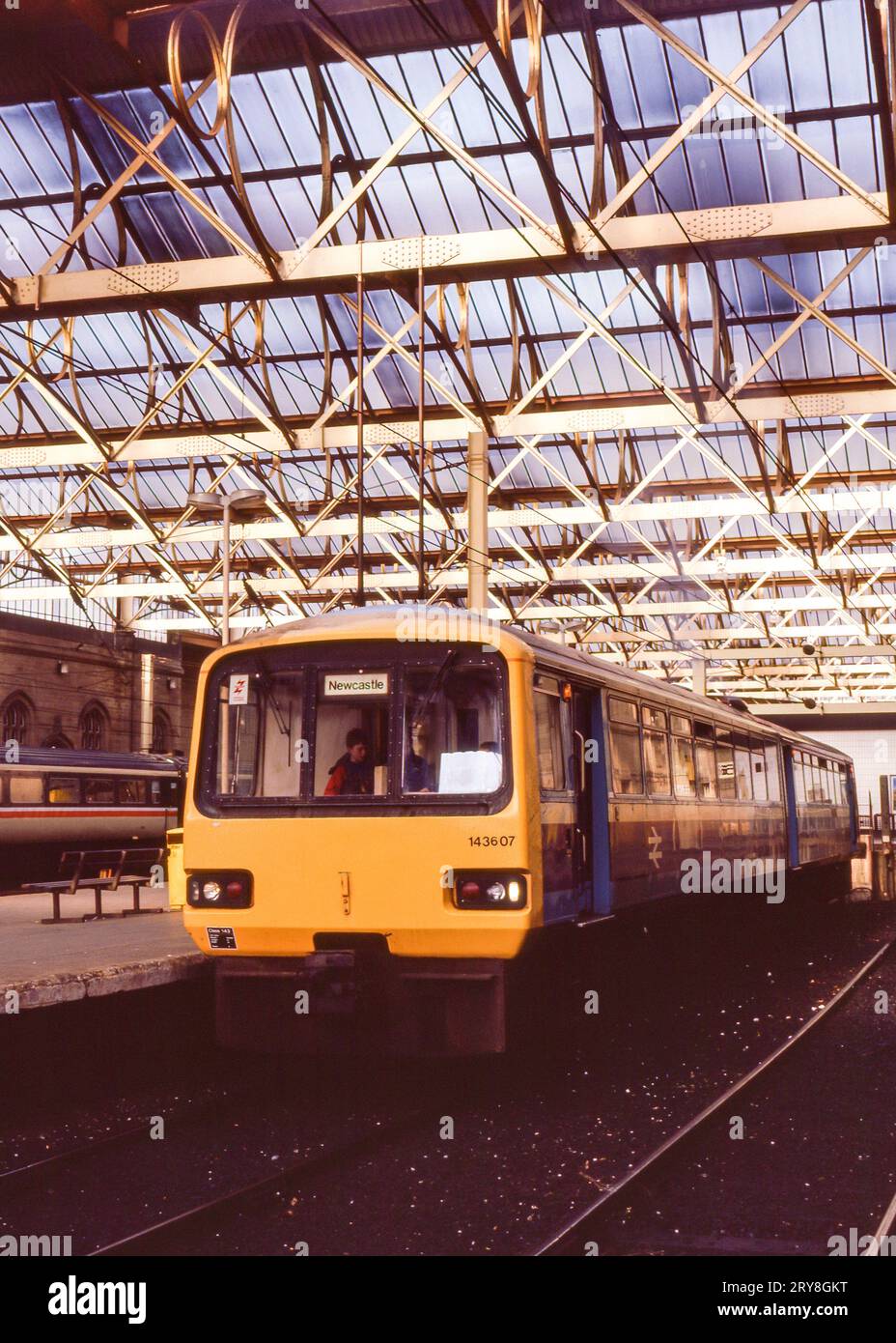 Small passenger train under a big roof Stock Photo - Alamy