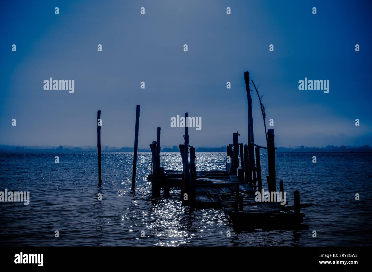 Old dock moon light reflection Stock Photo - Alamy