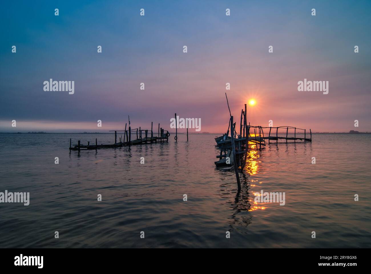 Old dock sunrise Stock Photo - Alamy