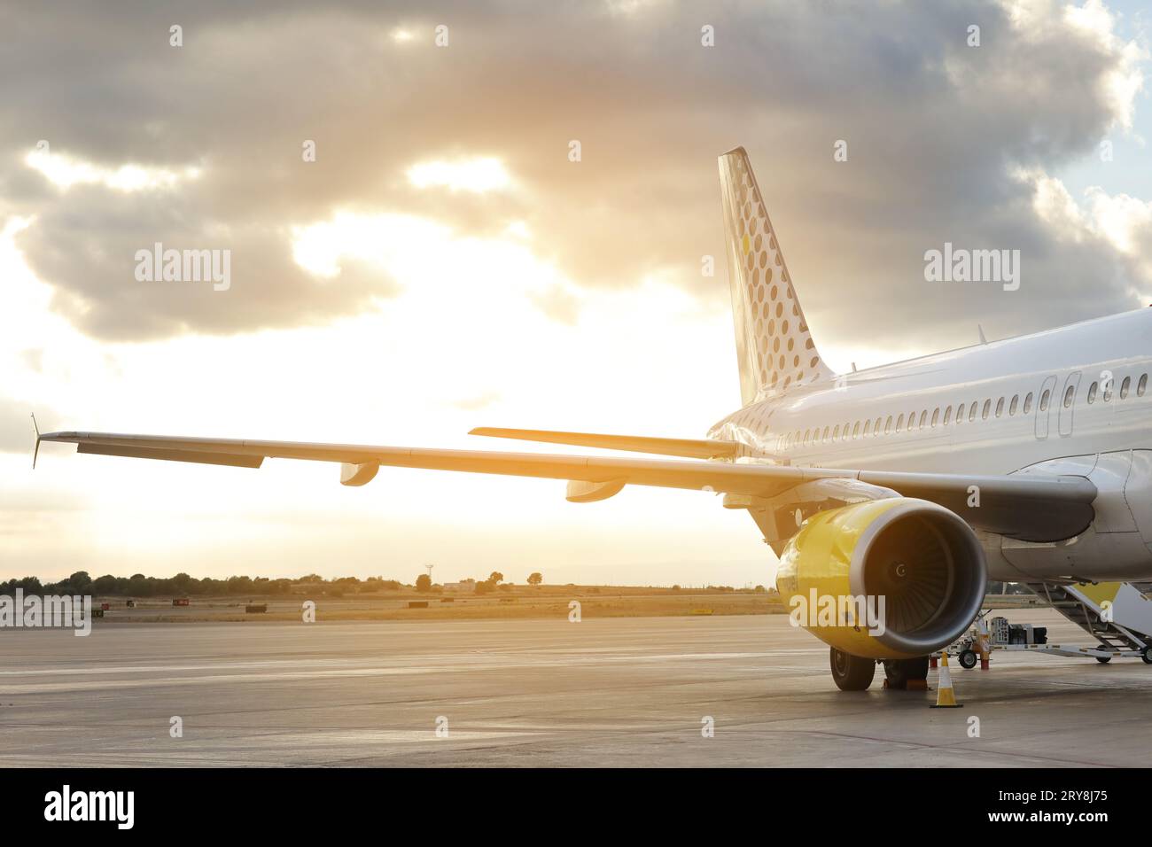 Side view of aircraft wing and engine of large white passenger airplane ...