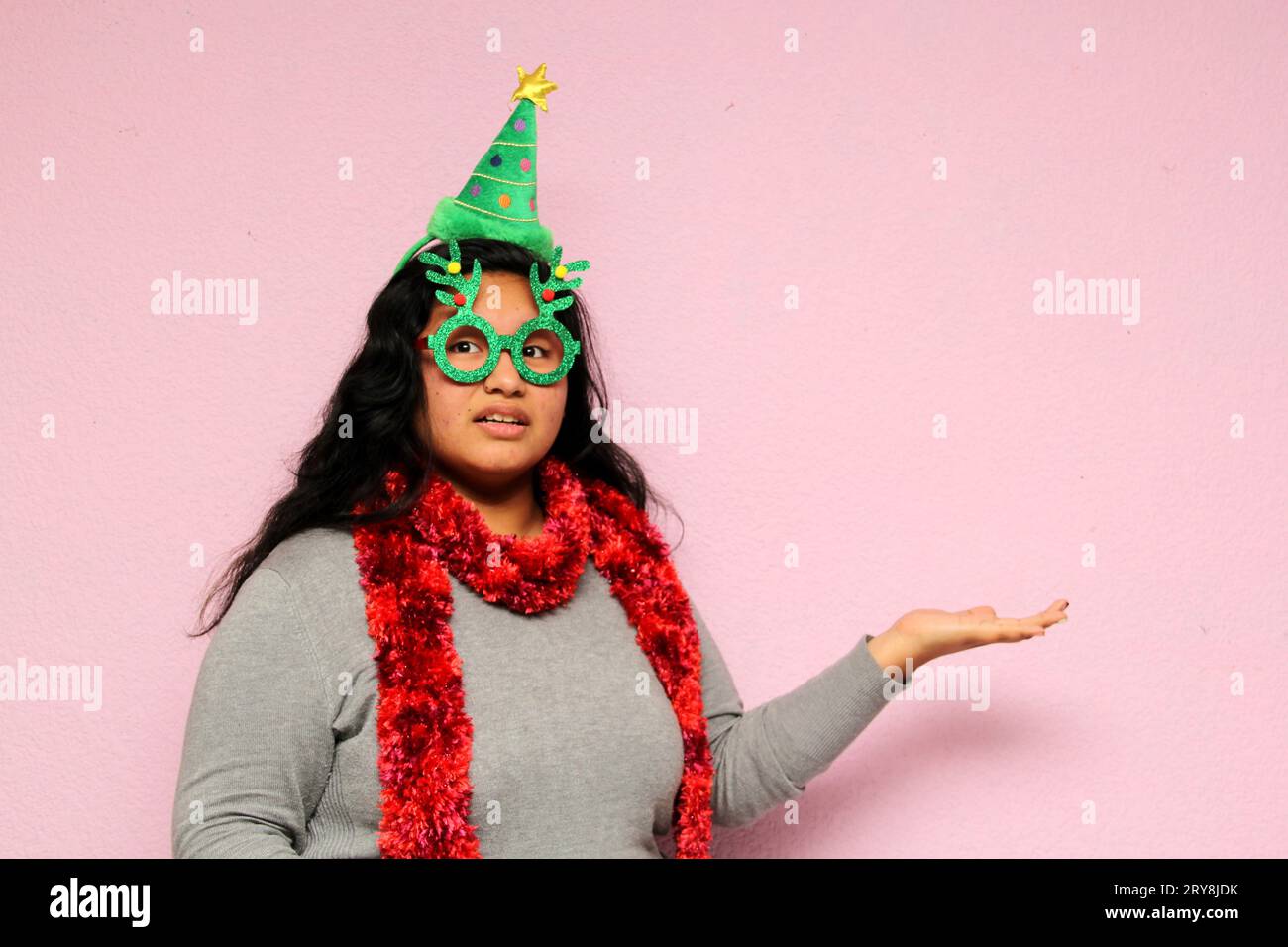 Young fat overweight body positive Latina with Christmas hat shows ...