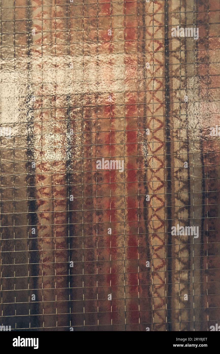 A board in a small pattern under a layer of resin. Background texture ...