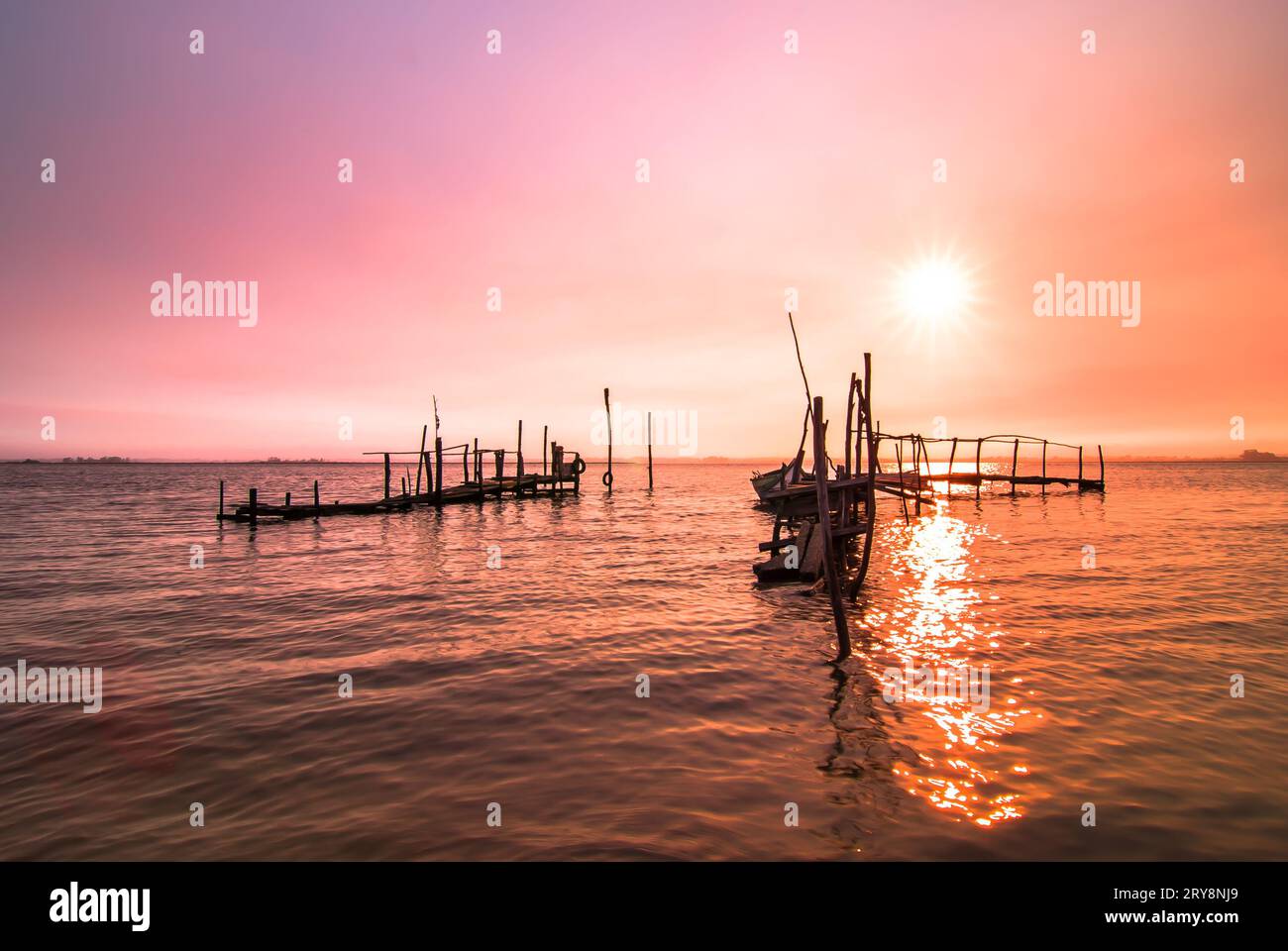 Old dock sunrise Stock Photo - Alamy