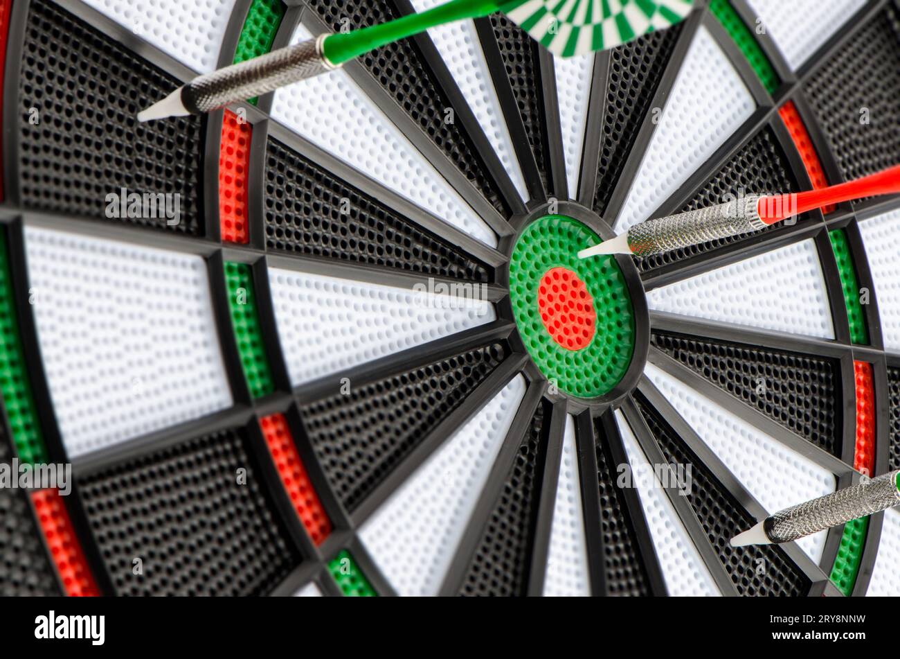 Dart board with darts Stock Photo - Alamy