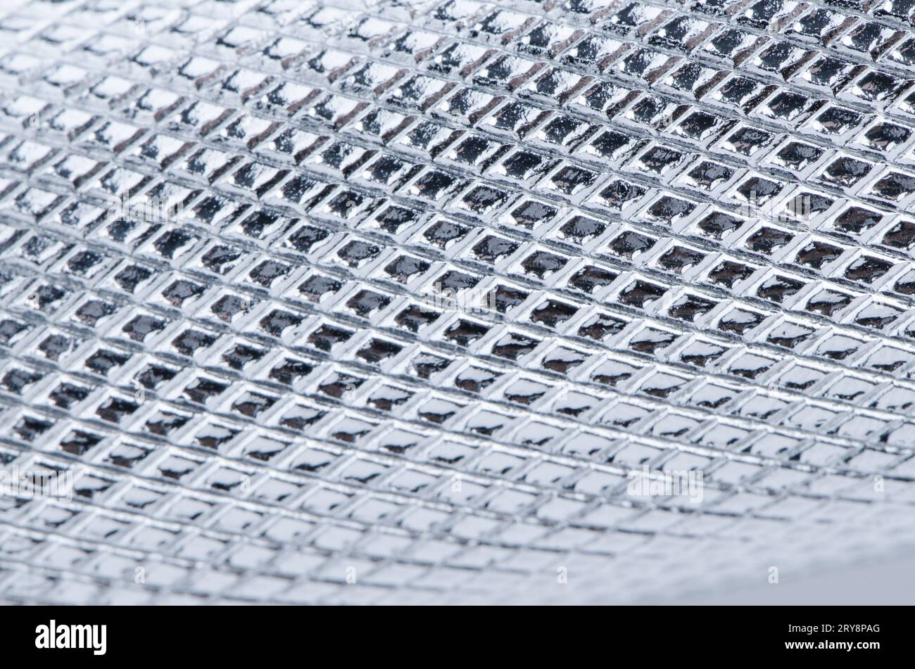 Metal mesh plating isolated against a white background Stock Photo - Alamy