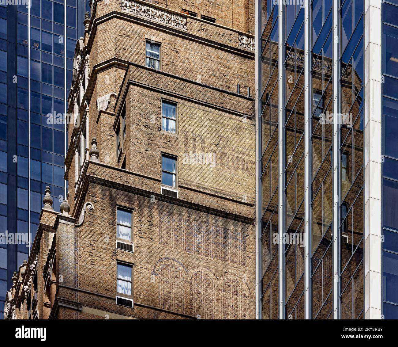 “Ghost” signage and a blind arcade are still visible on the upper ...