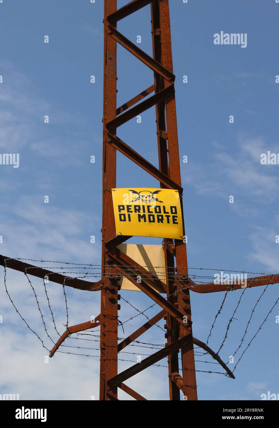high voltage pylon with the symbol of skull and the text meaning Danger ...
