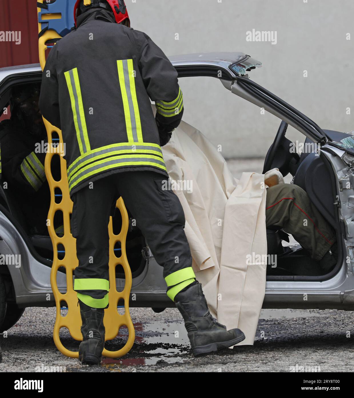 firefighters in action during the rescue of the injured after the car ...
