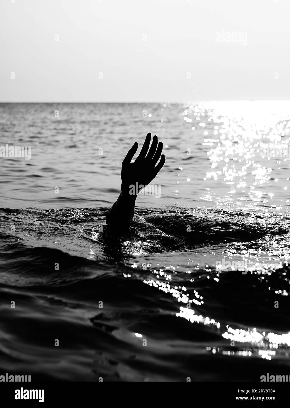 hand of the person about to drown in the middle of the ocean in very ...