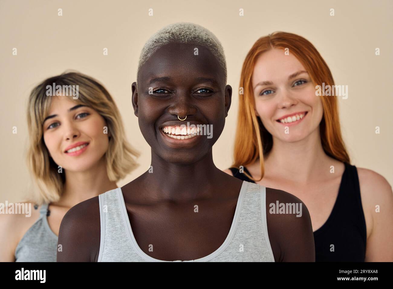 Happy cool gen z Black blonde girl with diverse models on background ...