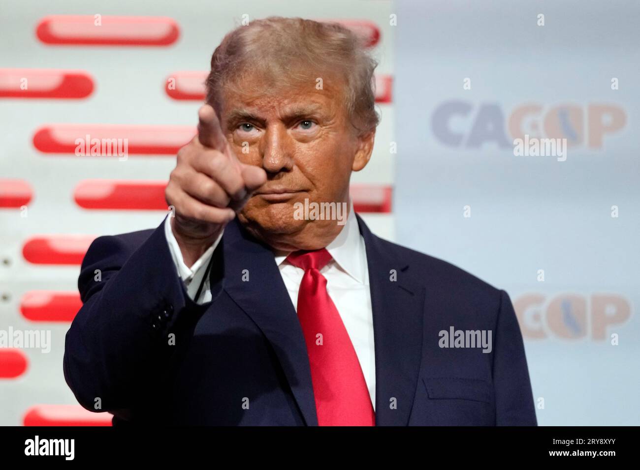 Former President Donald Trump points to the crowd before his speech at ...