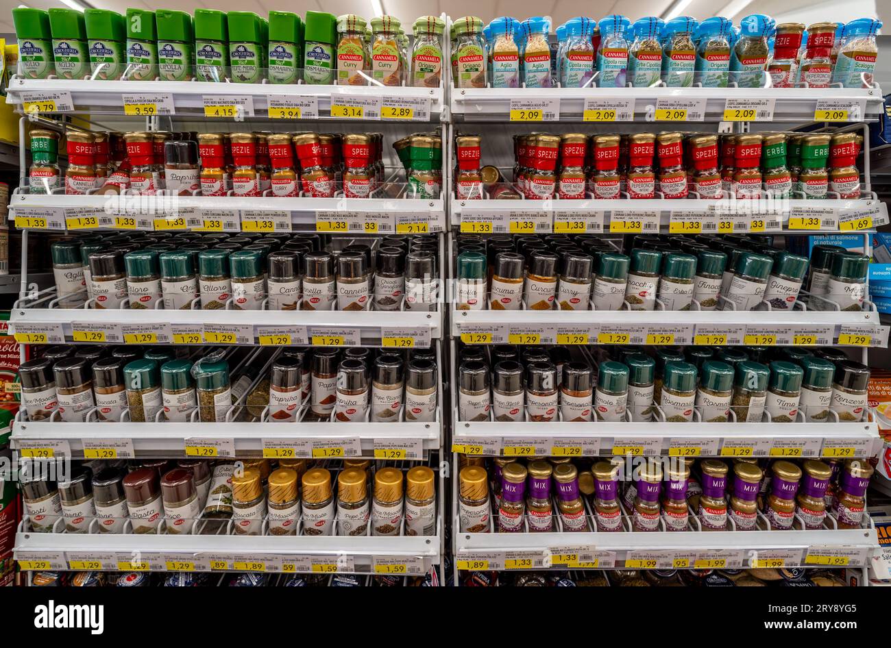 Italy - July 29, 2023: Cooking Spices of various kinds in glass bottles ...