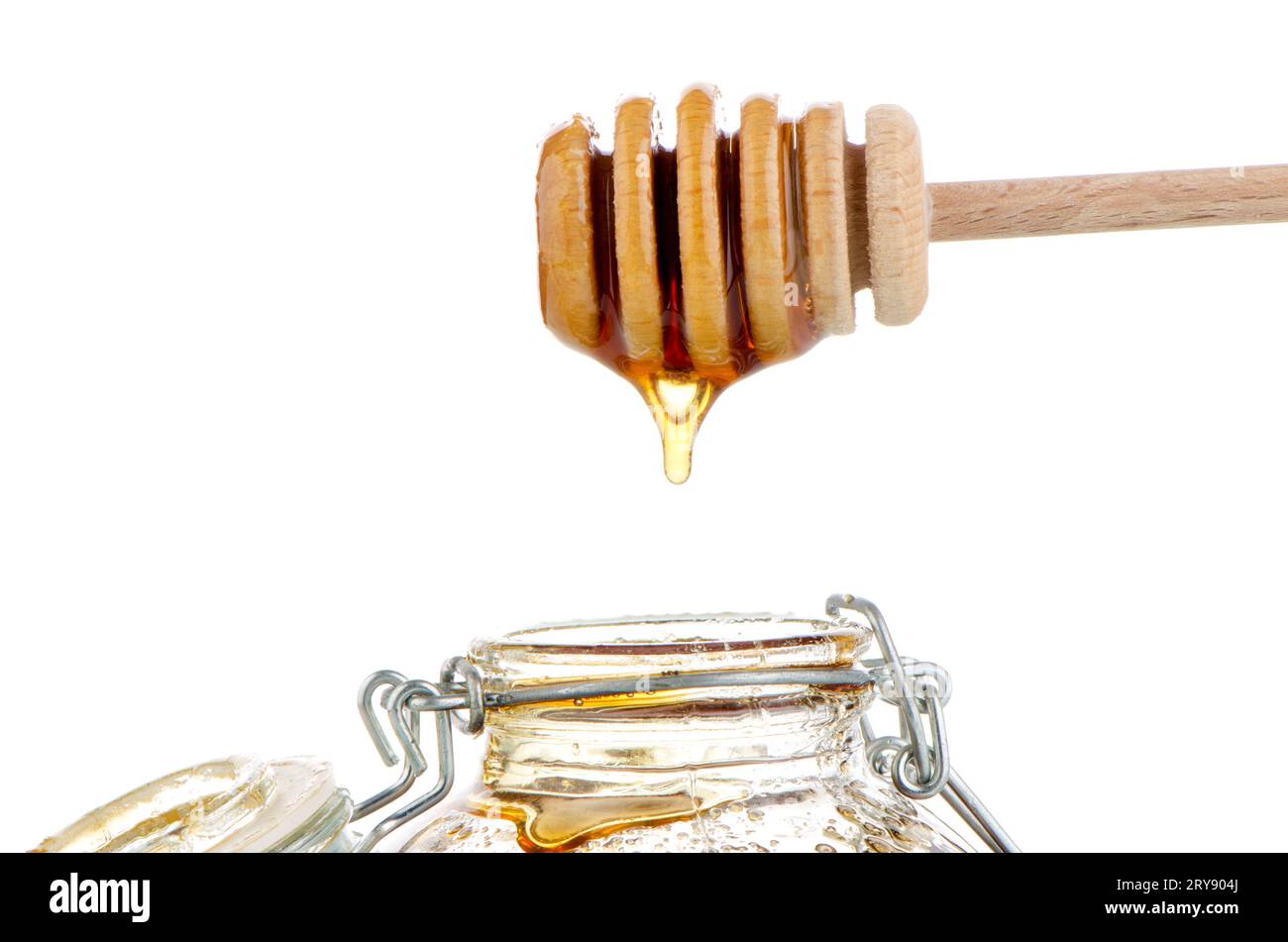 Pouring honey jar Cut Out Stock Images & Pictures - Alamy