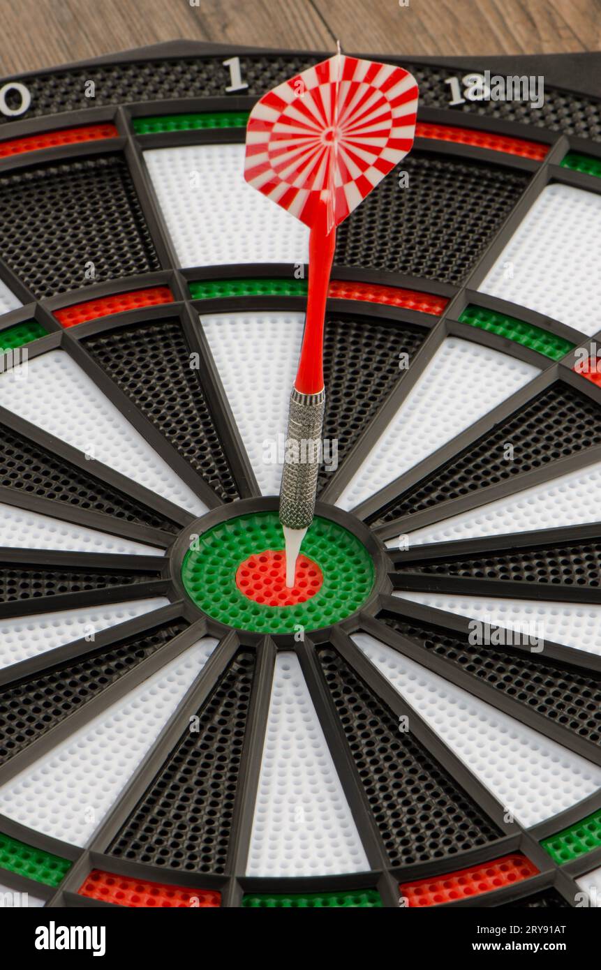 Dart board with dart Stock Photo - Alamy