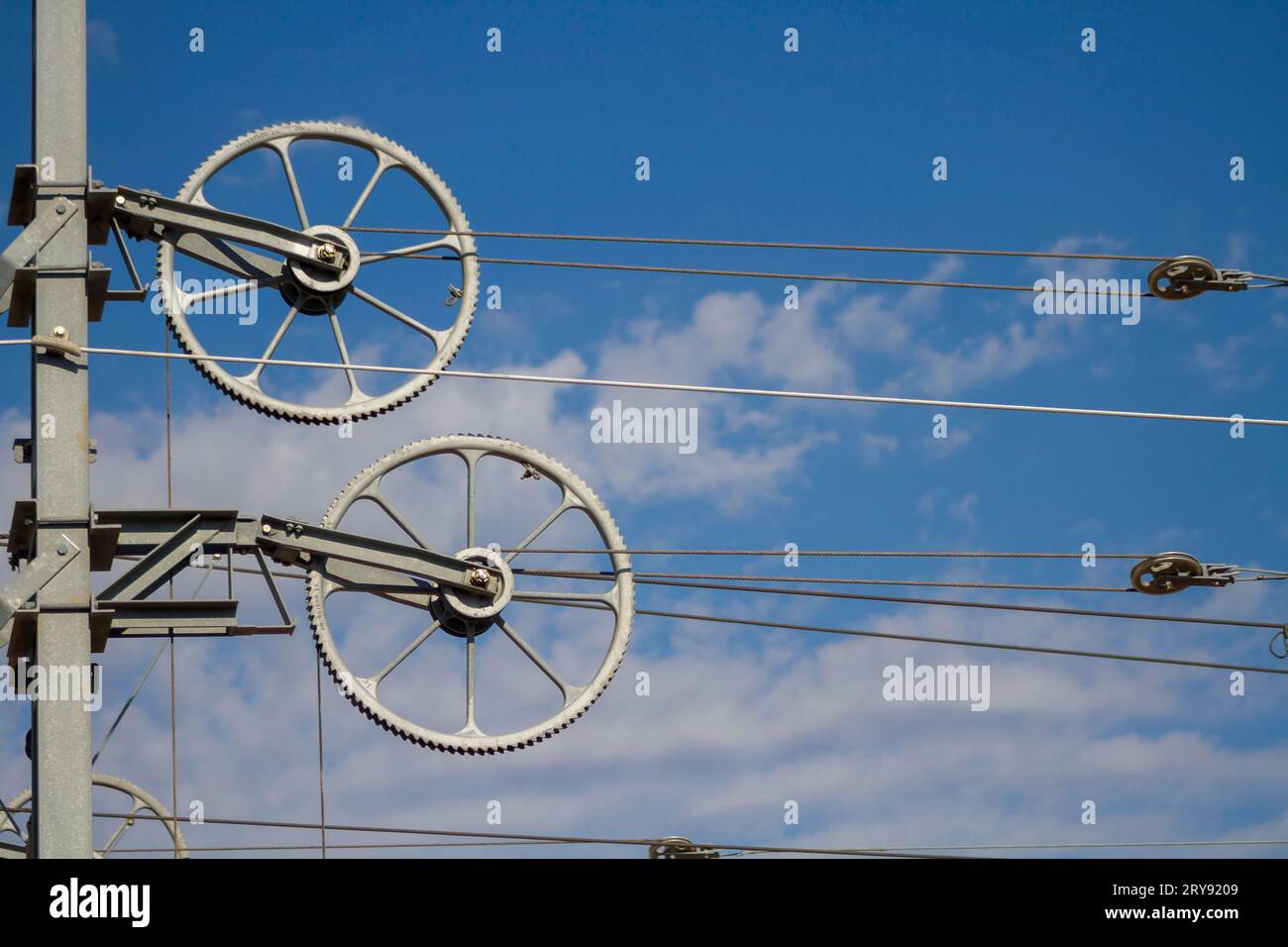 Railway line mast with wheel tensioning station, Majorca Stock Photo ...