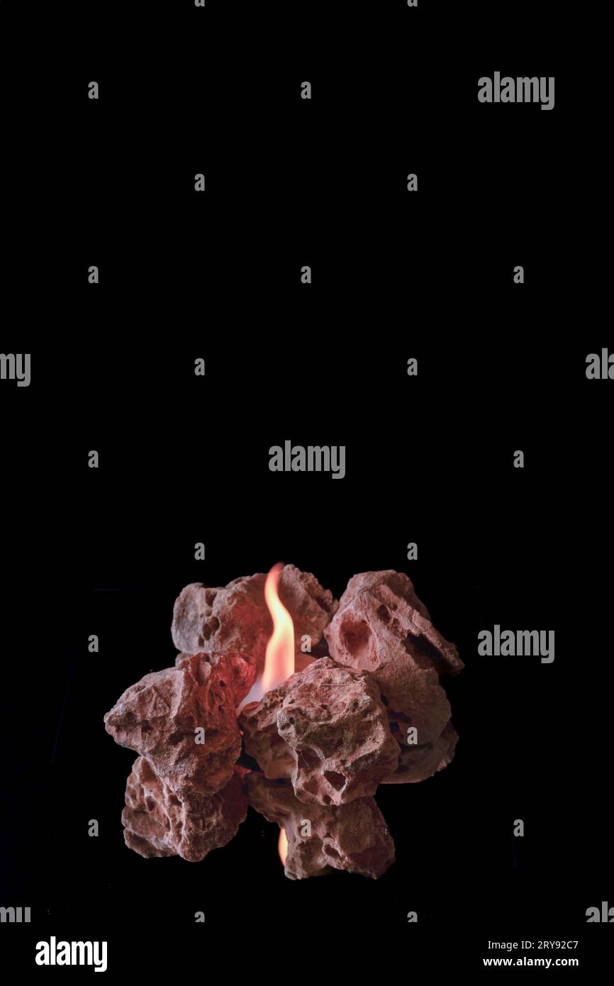 Group of colorful stones with fire flames reflected on the ground ...