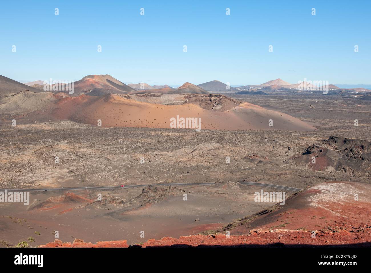 View of large crater of extinct volcano, Montanas del Fuego, Timanfaya ...