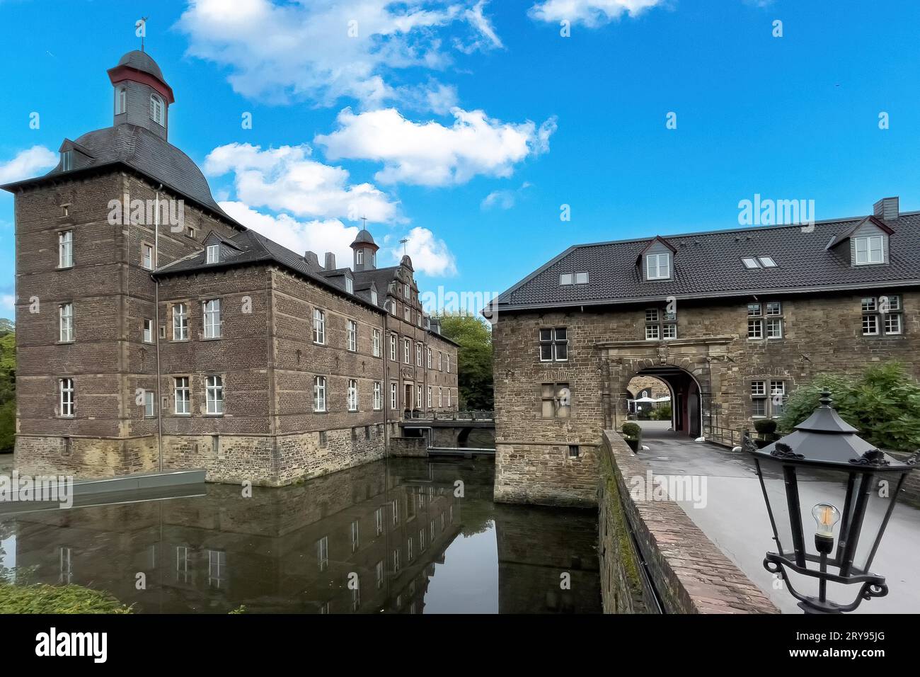 View of the main house of the moated castle Schloss Hugenpoet on the ...
