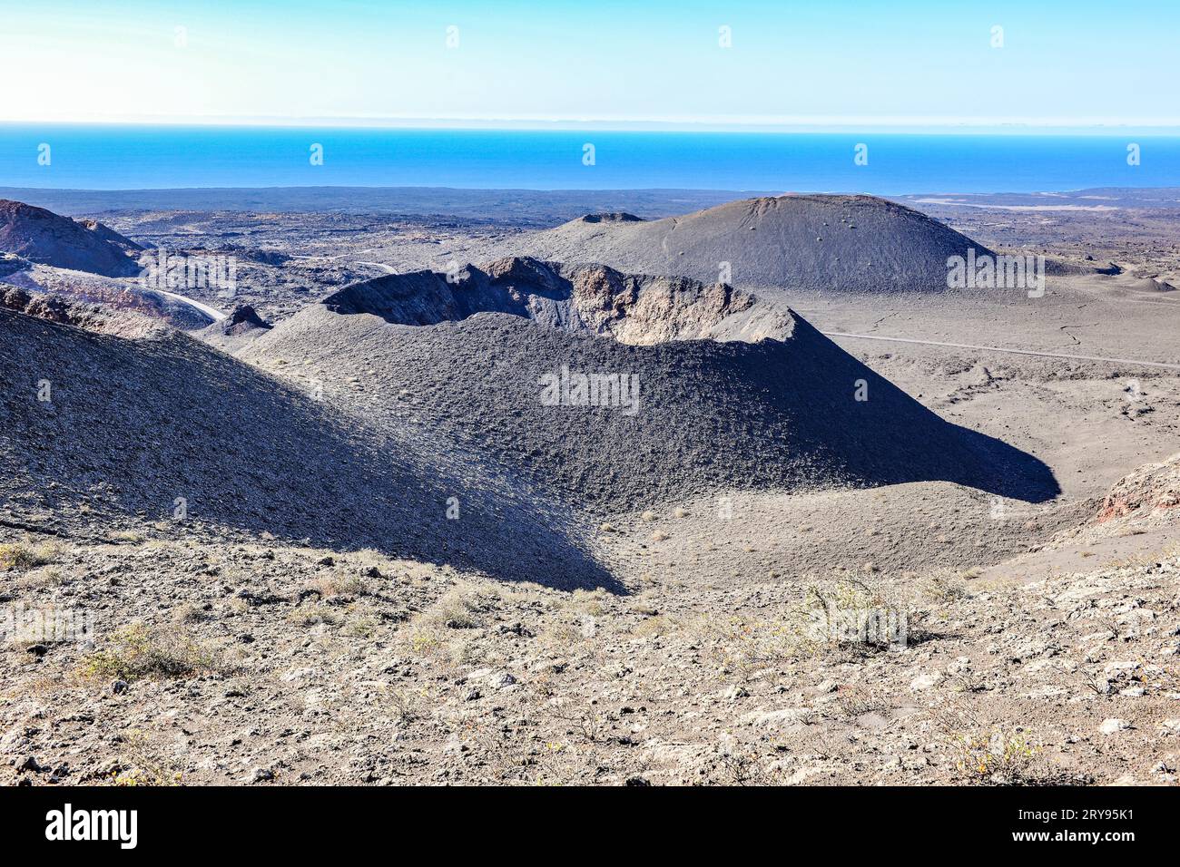 View of large crater of extinct volcano, Montanas del Fuego, Timanfaya ...
