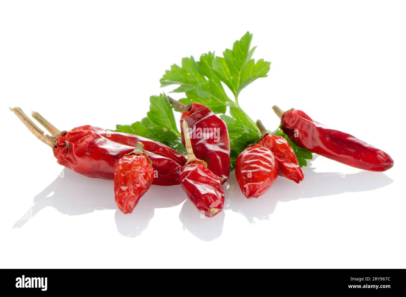 Red chili or chilli pepper and parsley leaves Stock Photo - Alamy
