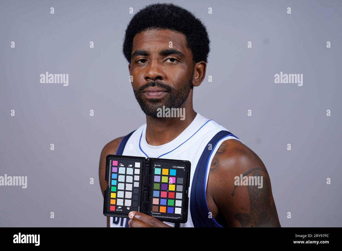Dallas Mavericks guard Kyrie Irving prepares to pose for a photo during ...