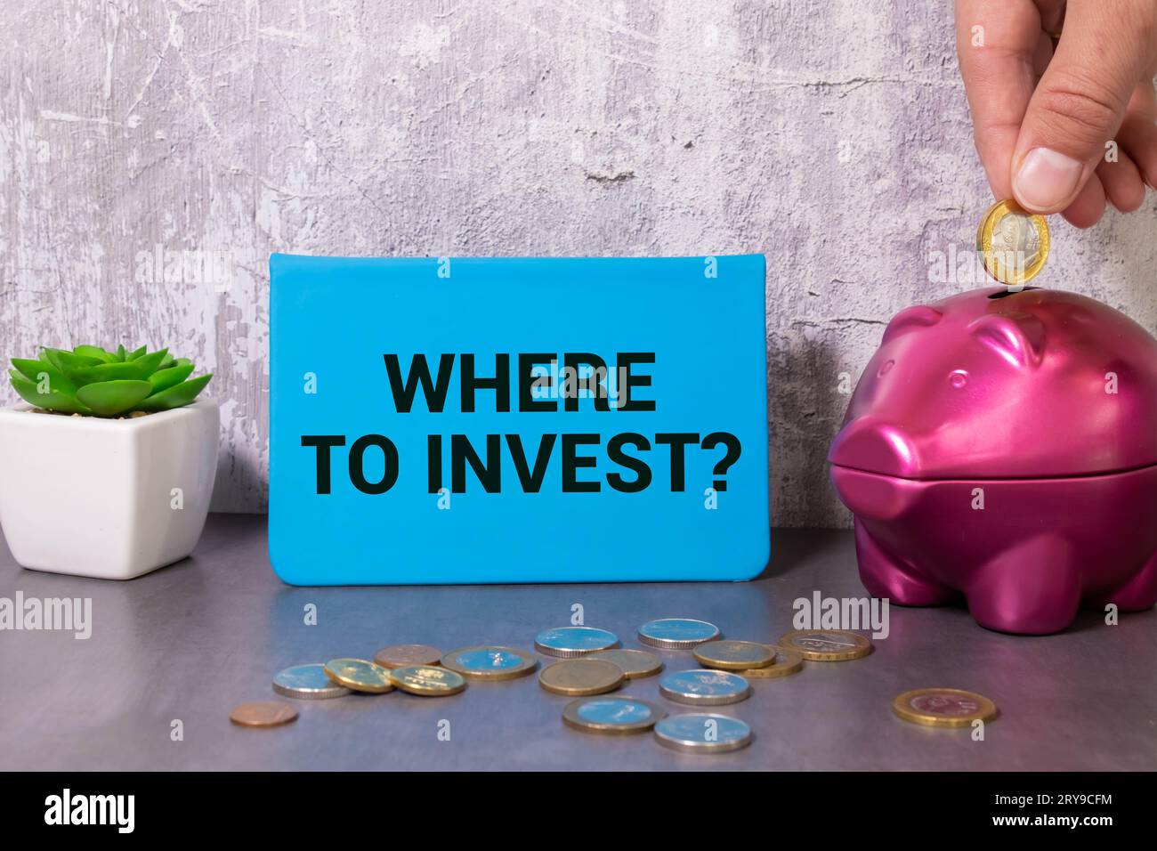 Hand writing the text: Where to Invest Stock Photo - Alamy