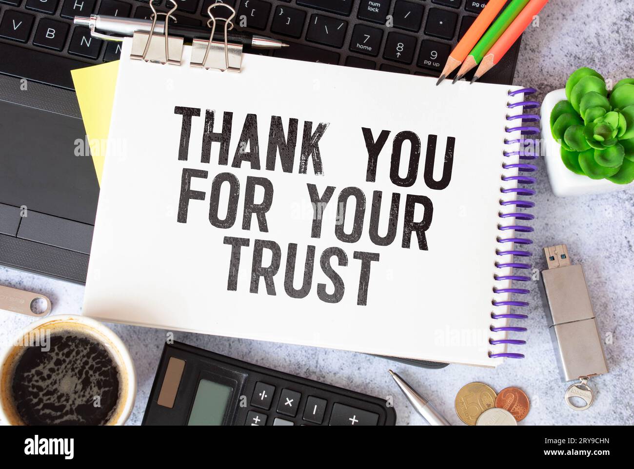 Thank you for your trust. text on white paper over torn paper ...