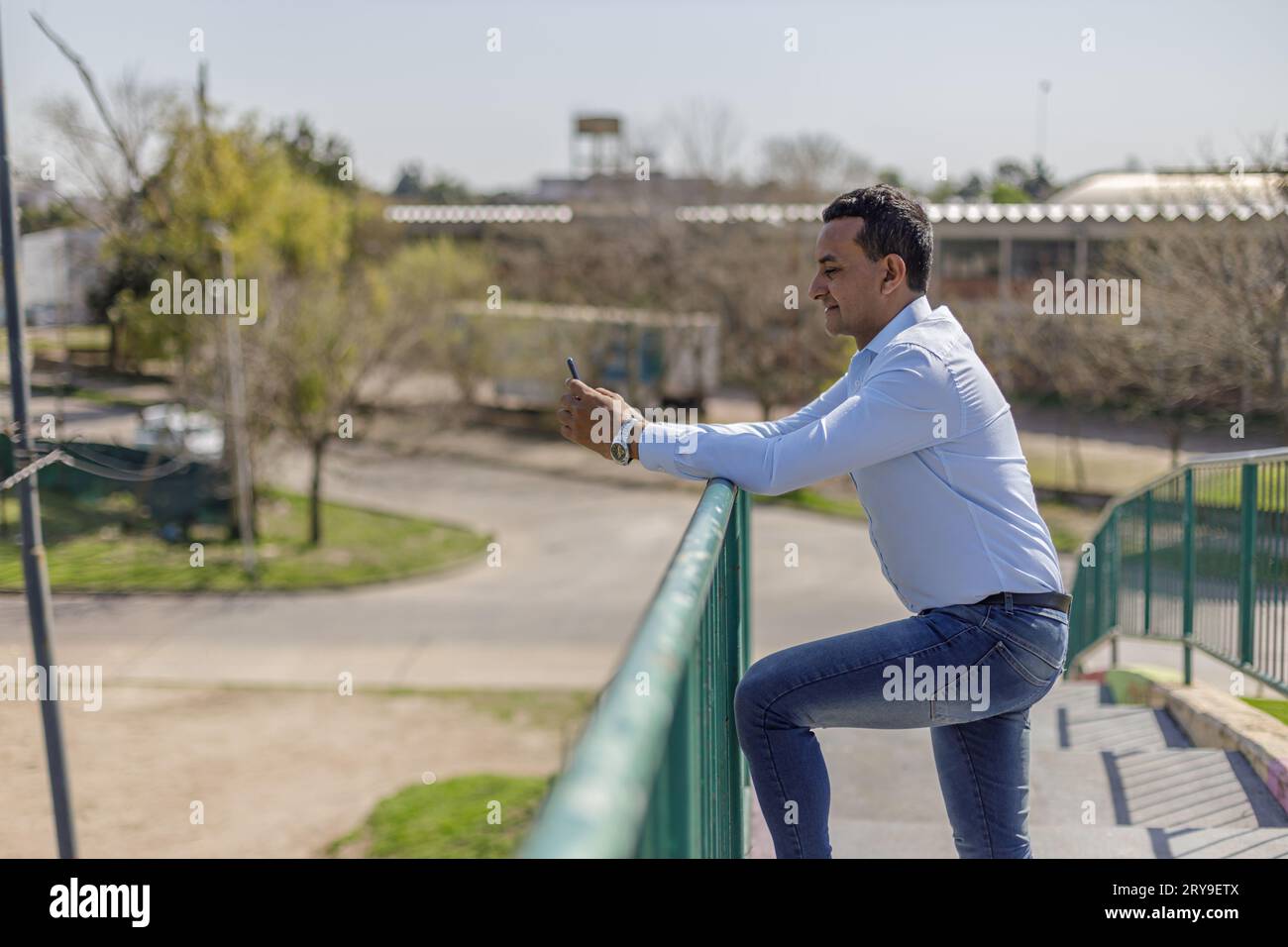 Man leaning on pedestrian bridge hi-res stock photography and images ...