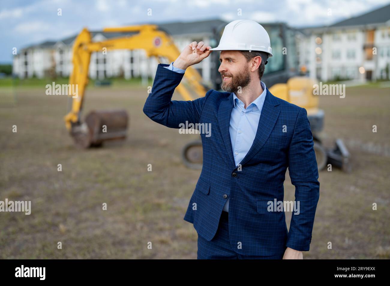 cheerful construction business owner at site. construction business ...