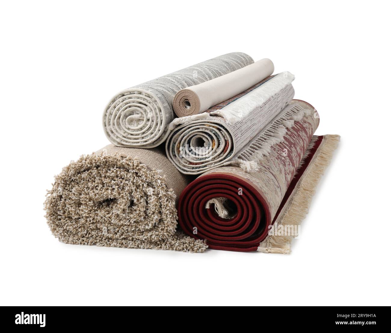 Rolled carpets on white background. Interior element Stock Photo - Alamy