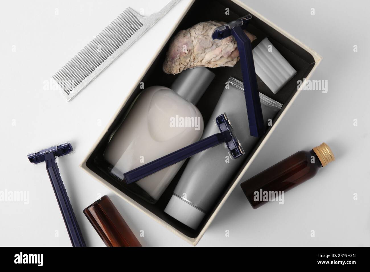 Different men's shaving accessories and box on white background, flat ...