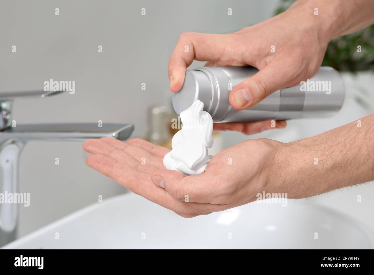 Man applying hair mousse hi-res stock photography and images - Alamy