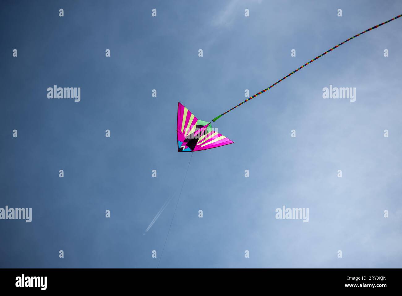 Colorful Asian silk kite flying against the blue sky Stock Photo - Alamy