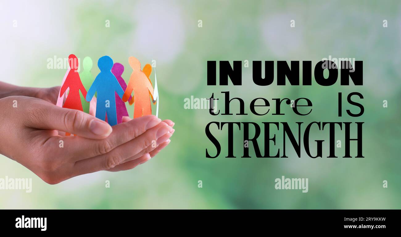 Partnership, union and togetherness. Woman holding paper humans joined ...