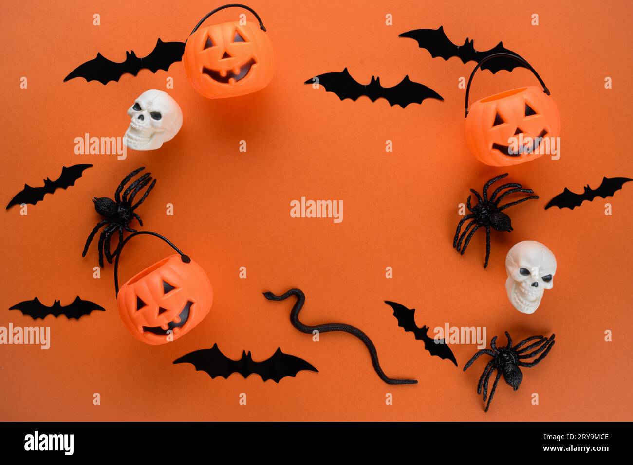 Assorted halloween items. Toys, jack-o-lantern buckets, skeletons ...