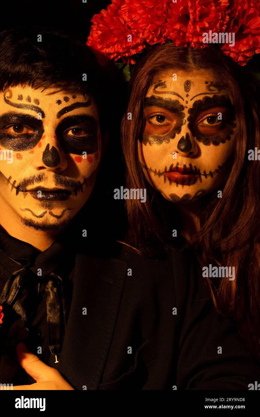 young couple with catrin and catrina skull makeup at day of the dead ...