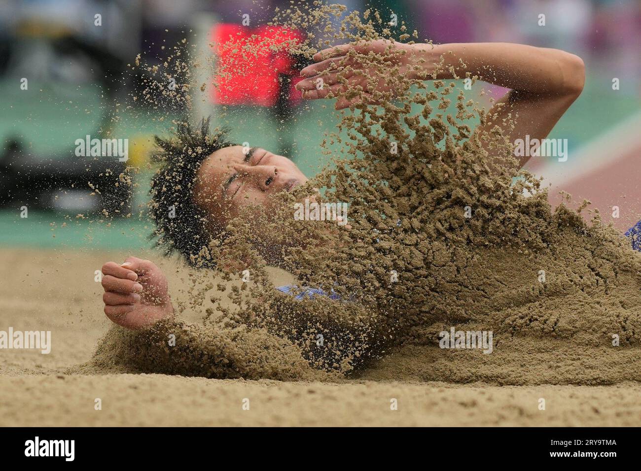 Taiwan's Lim Yu-Tang competes during the men's long jump qualification ...